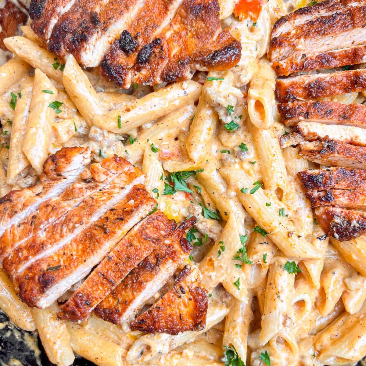 Creamy Italian Sausage Pasta with Cajun Chicken - Bad Batch Baking